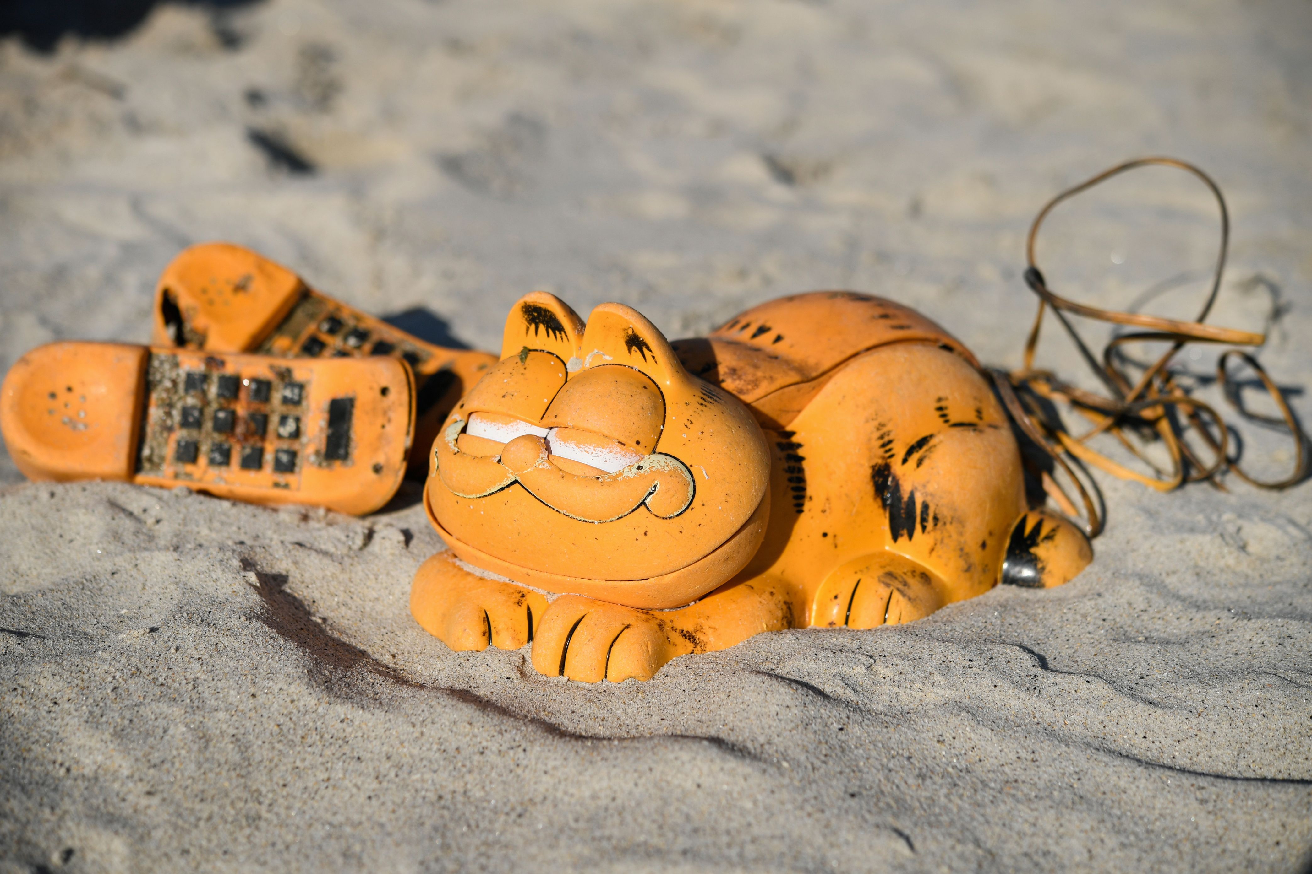 Mystery of Garfield Phones Washing Up on French Beached Solved After 35 ...