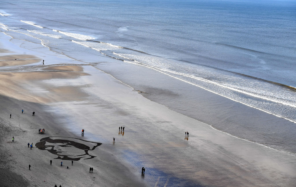 Artists Create Giant Portraits on UK Beaches of WWI Soldiers