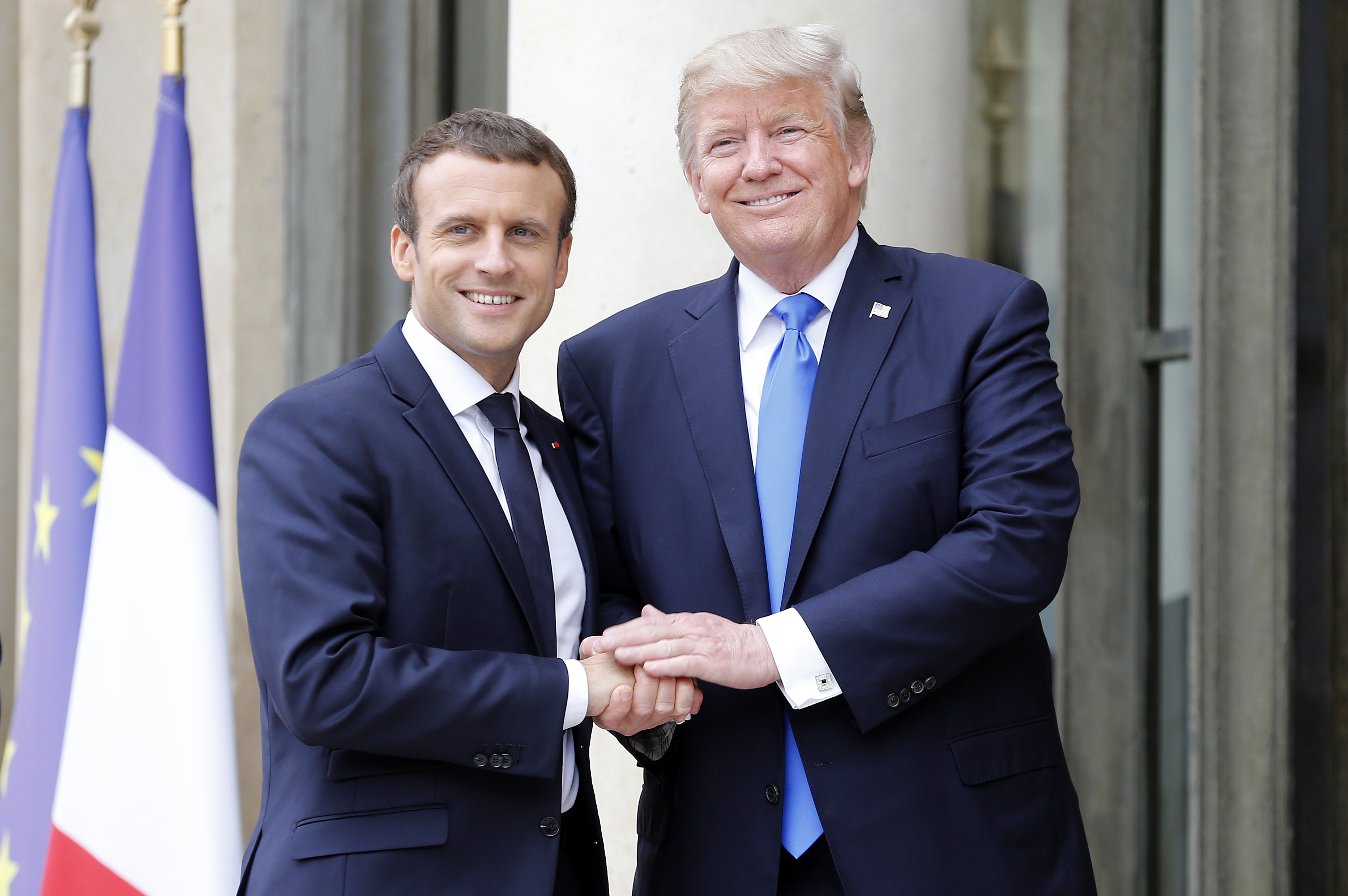 President Donald Trump, Emmanuel Macron Share Long Handshake