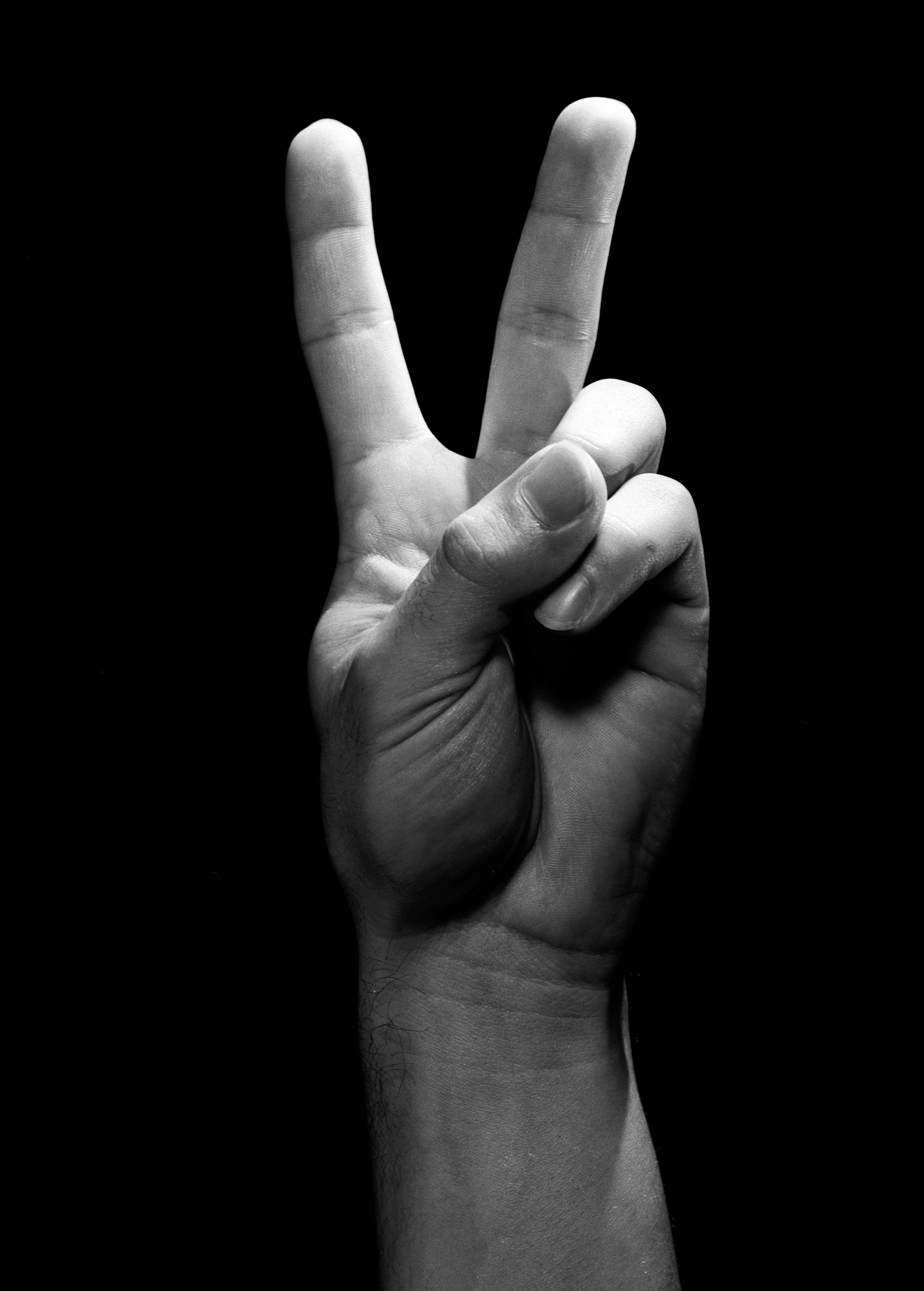 V-Sign: Why East Asians Make Peace Signs in Photos